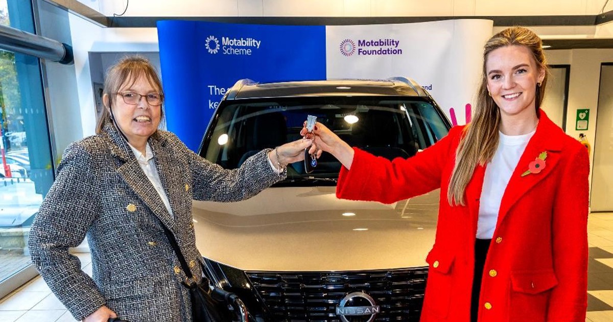 Kate Dearden MP presents keys at car handover in Halifax